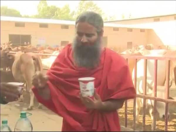 Baba Ramdev launches toned milk cheaper than Mother Dairy