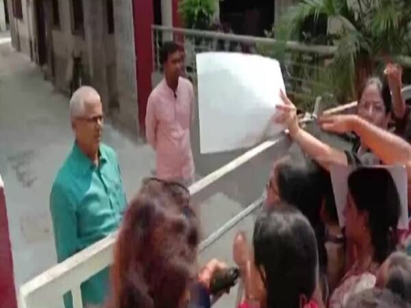 Neighbors of Sushil Modi protest outside his house in Patna